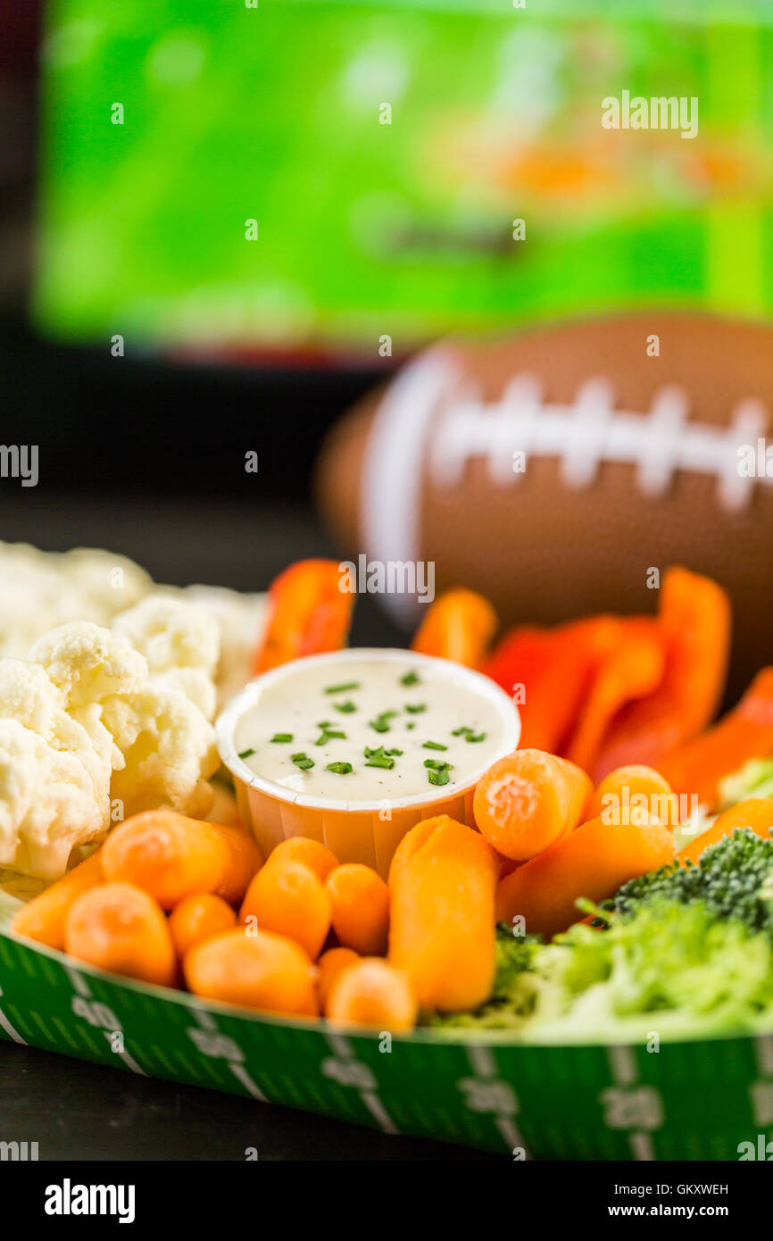 Sliders with veggie tray on the table for the football party Stock ...