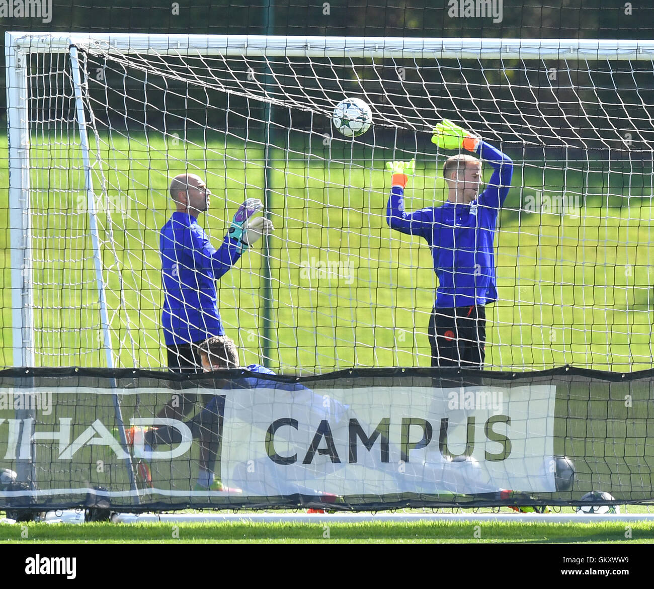 Manchester City goalkeeper Joe Hart (right) and Willy Caballero during ...