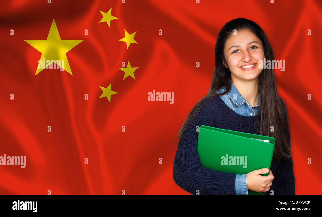 Teen student smiling over Chinese flag. Concept of lessons and learning ...