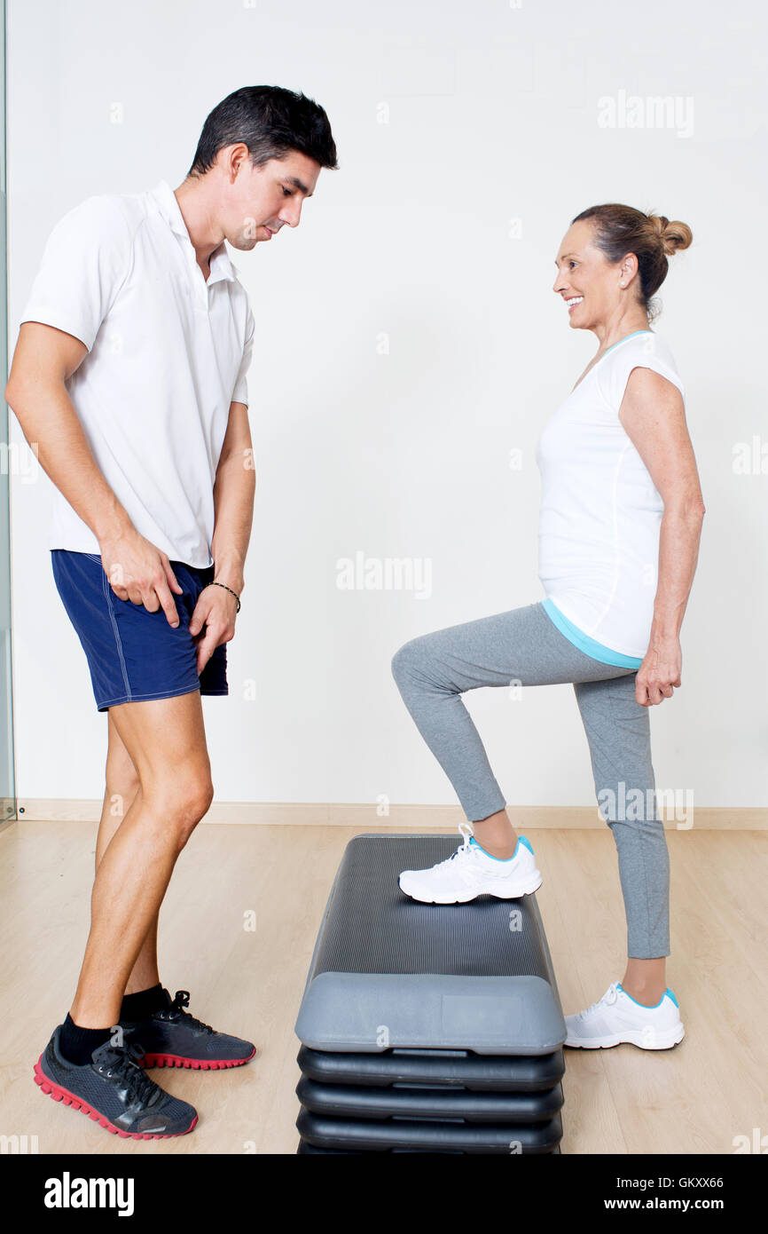 Female coach correct step exercise woman Stock Photo - Alamy