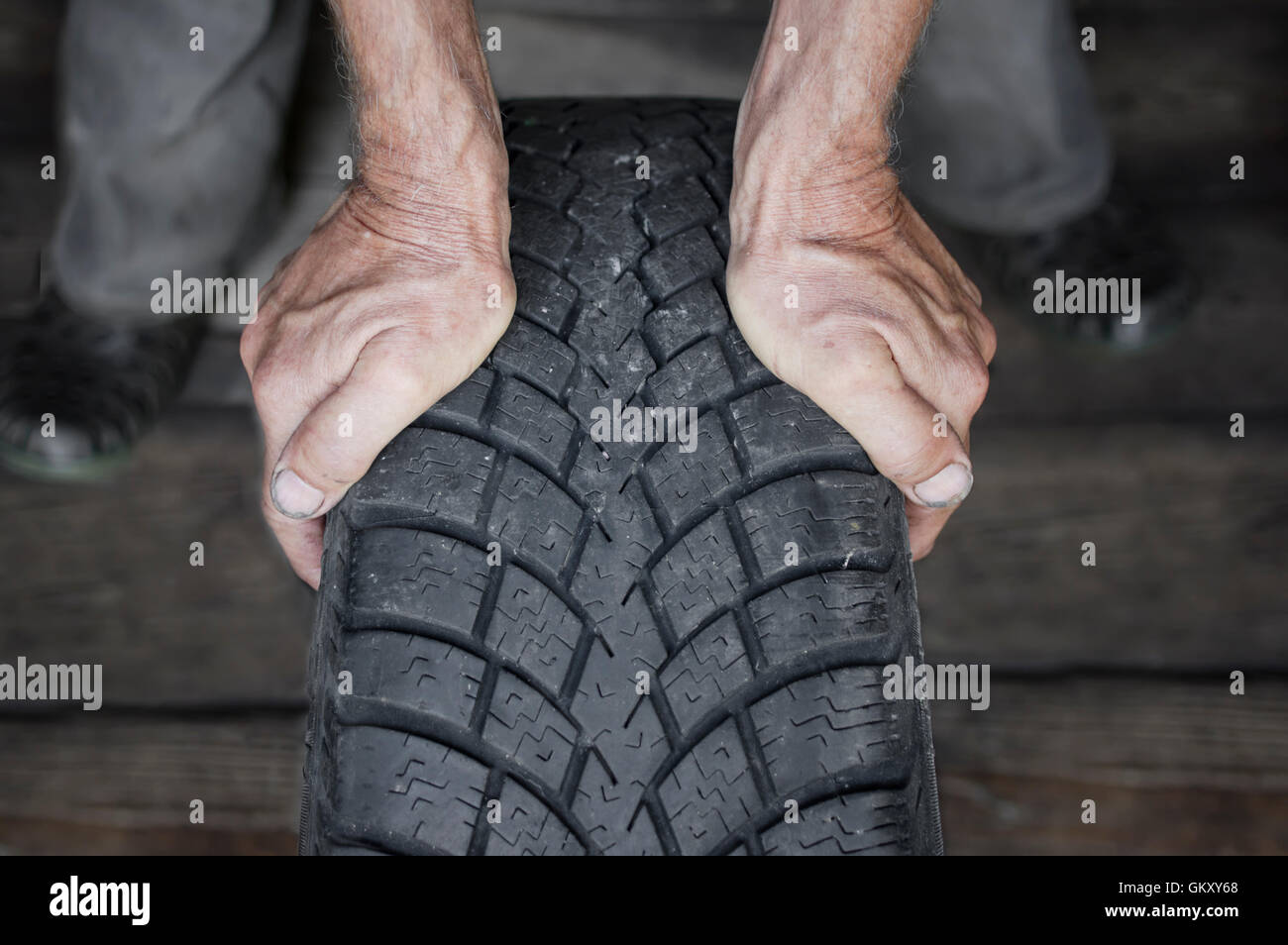 Holding tire hi-res stock photography and images - Alamy