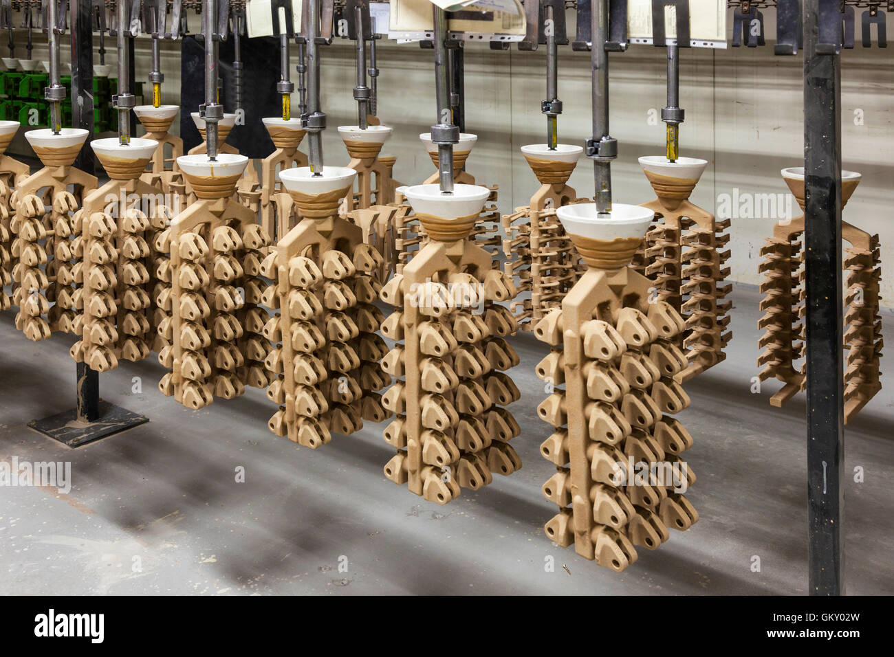 assembly line of casting trees for further processing Stock Photo - Alamy