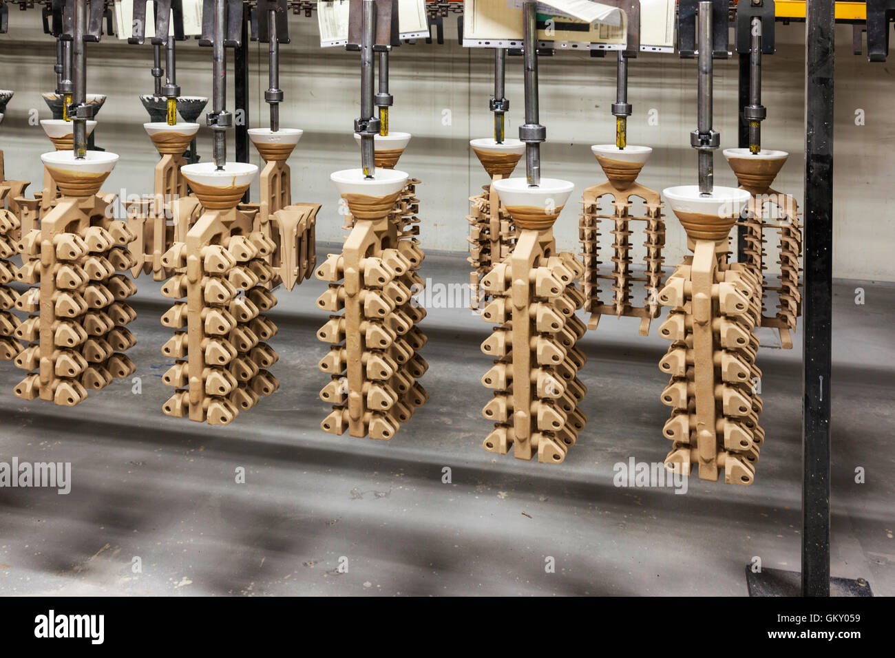 assembly line of casting trees for further processing Stock Photo - Alamy