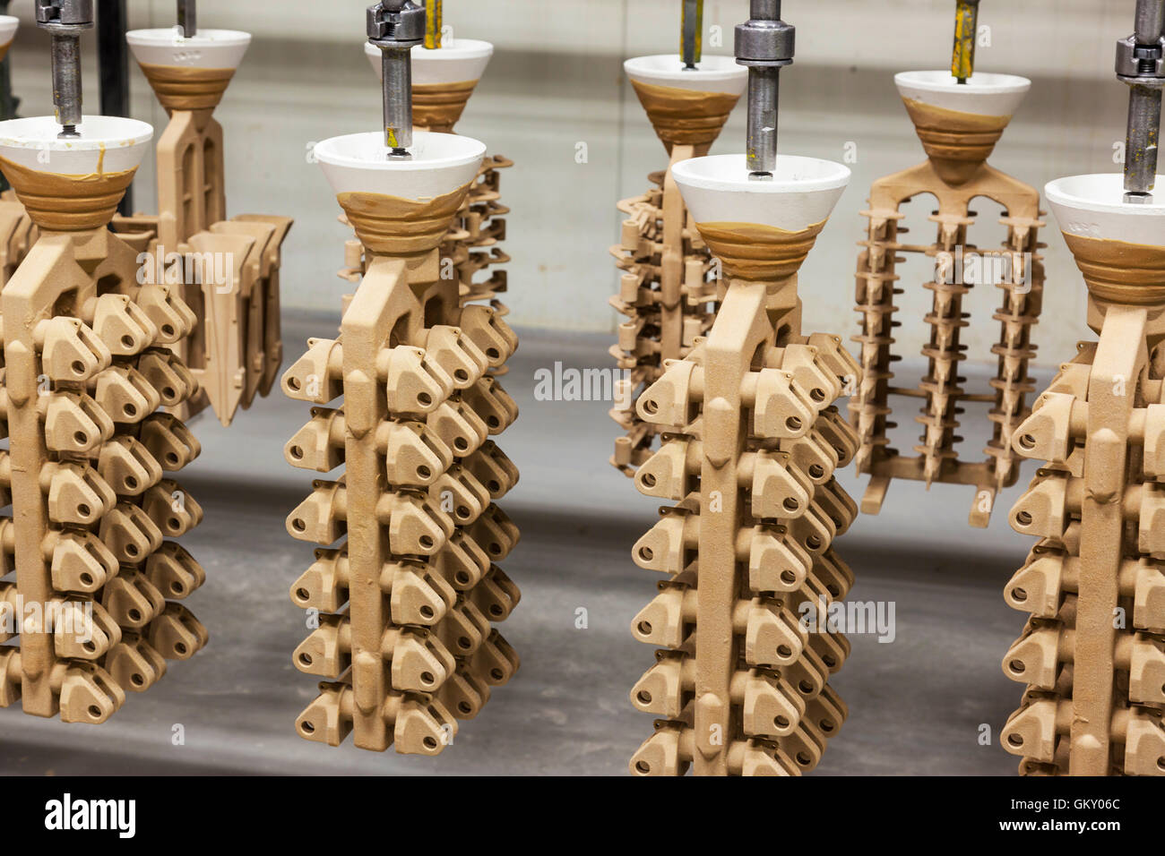 assembly line of casting trees for further processing Stock Photo - Alamy