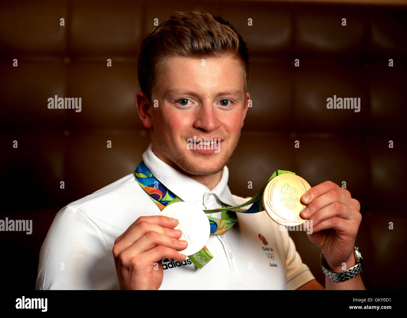 Great Britain's Adam Peaty poses with his gold and silver medals after ...