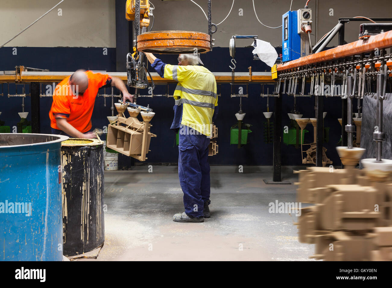 factory workers in a foundery Stock Photo - Alamy