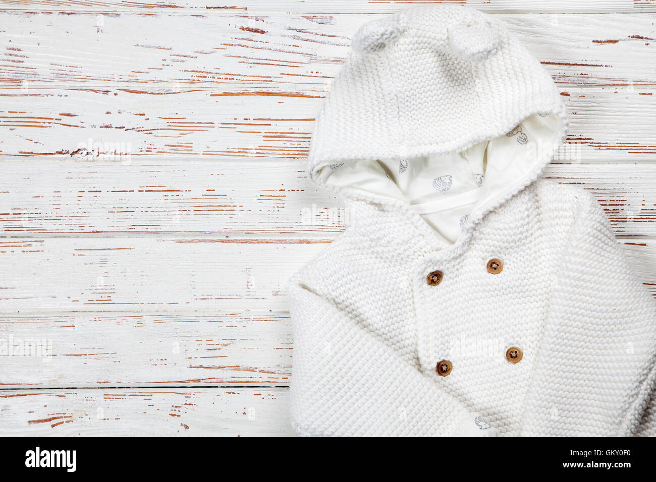 Baby clothes on table hi-res stock photography and images - Alamy