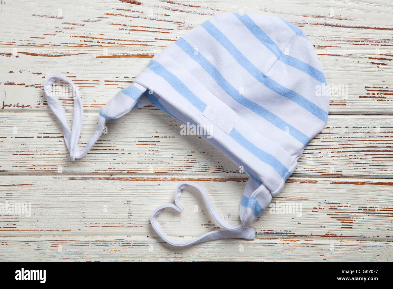 Baby clothes on wooden background Stock Photo - Alamy