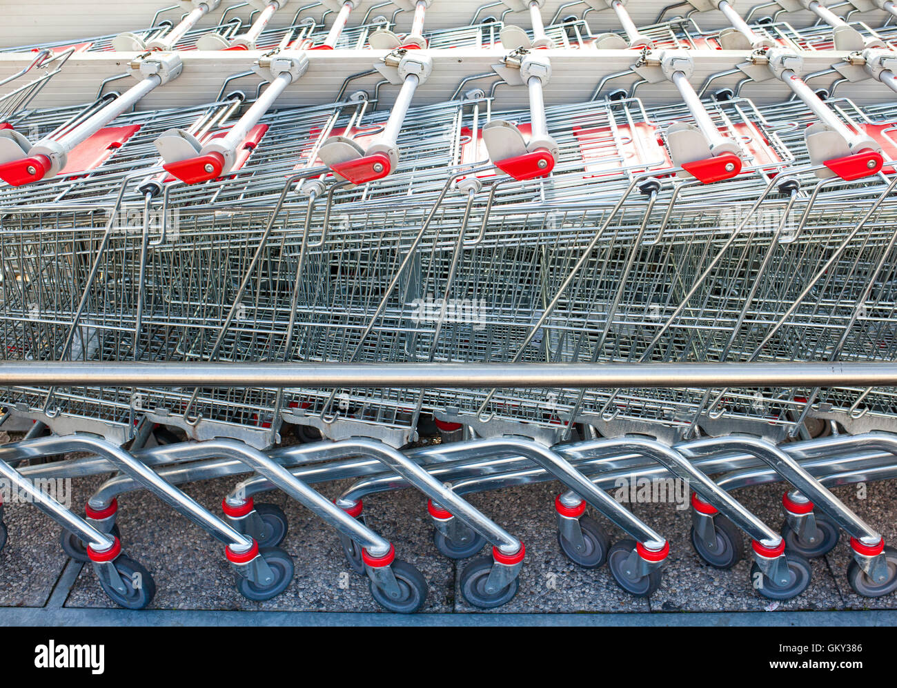 Rows of shopping carts at the entrance of supermarket Stock Photo - Alamy
