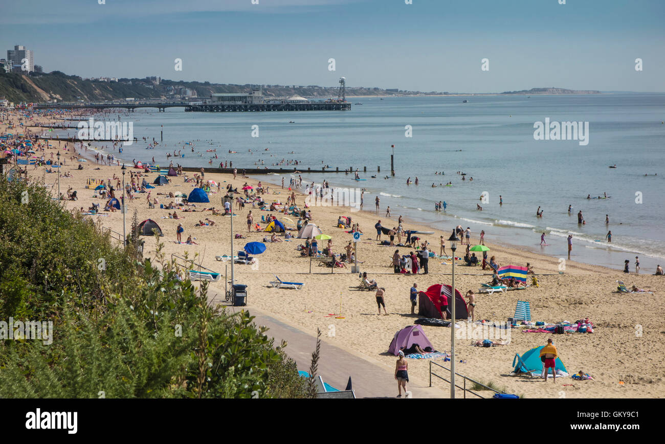 Bournemouth West Beach with holiday crowds enjoying the hot weather ...