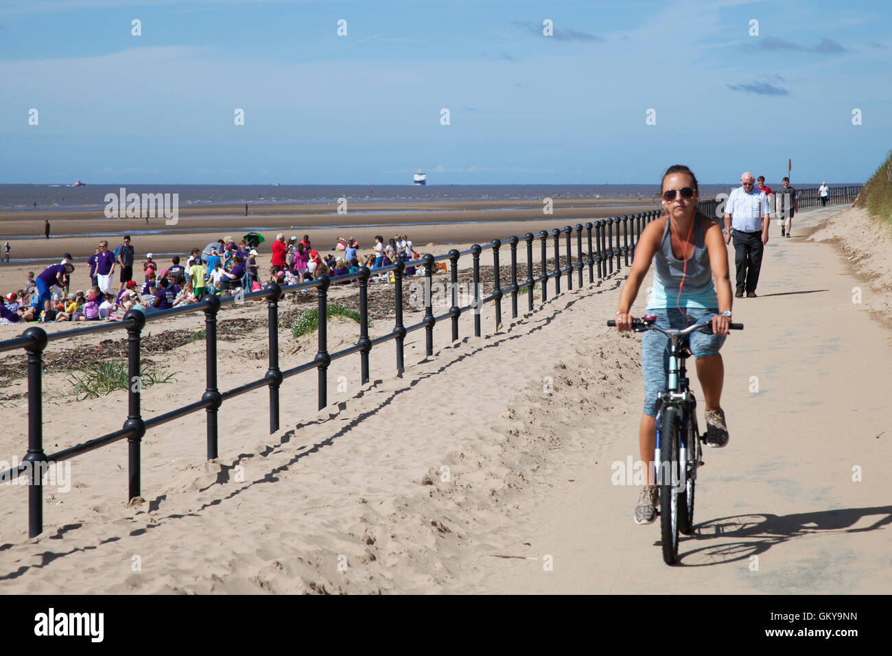 Sun seekers sunbathing on the beach hi-res stock photography and images ...