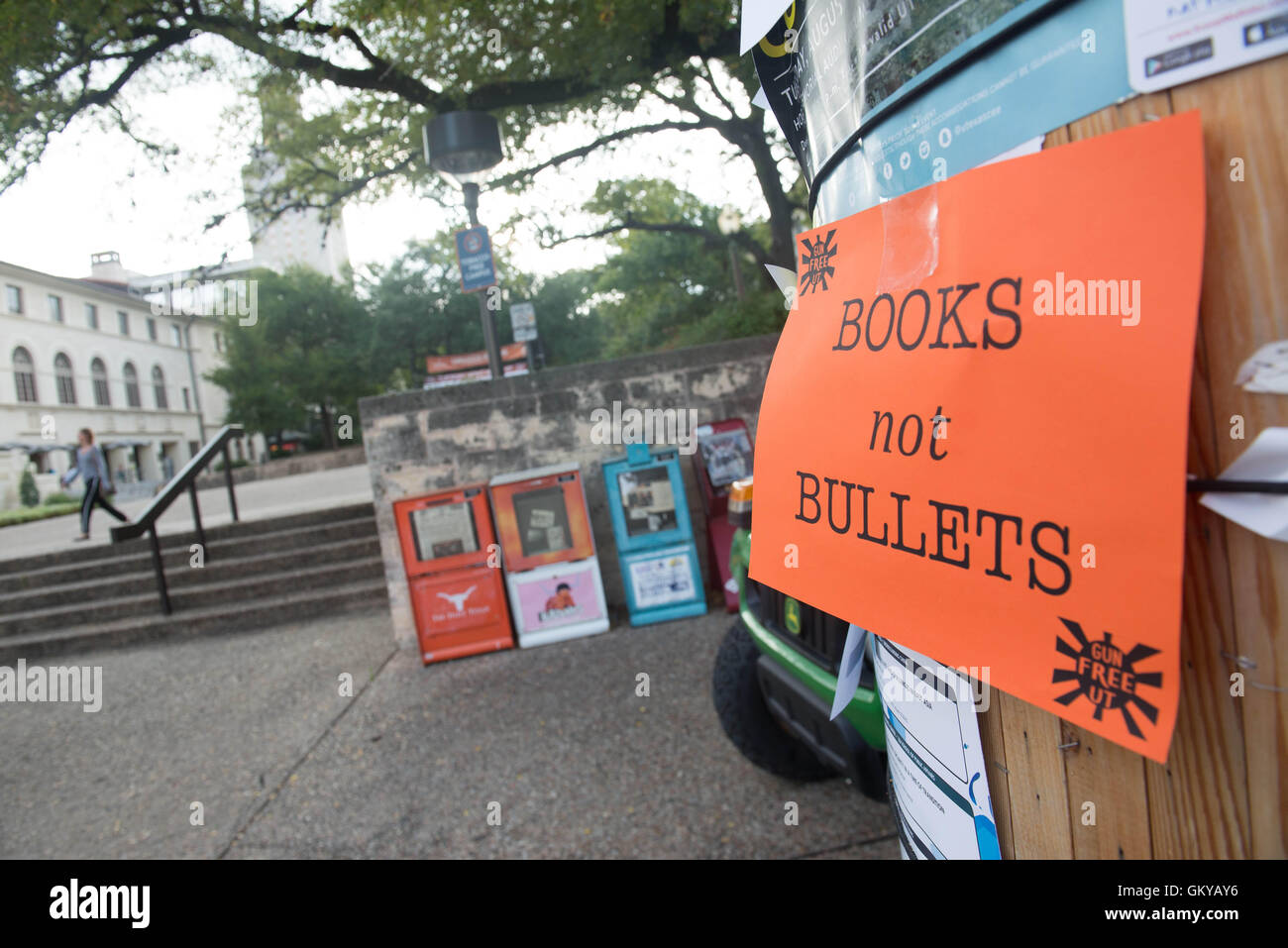 A books not bullets flyer is stapled to a bulletin board on display at ...