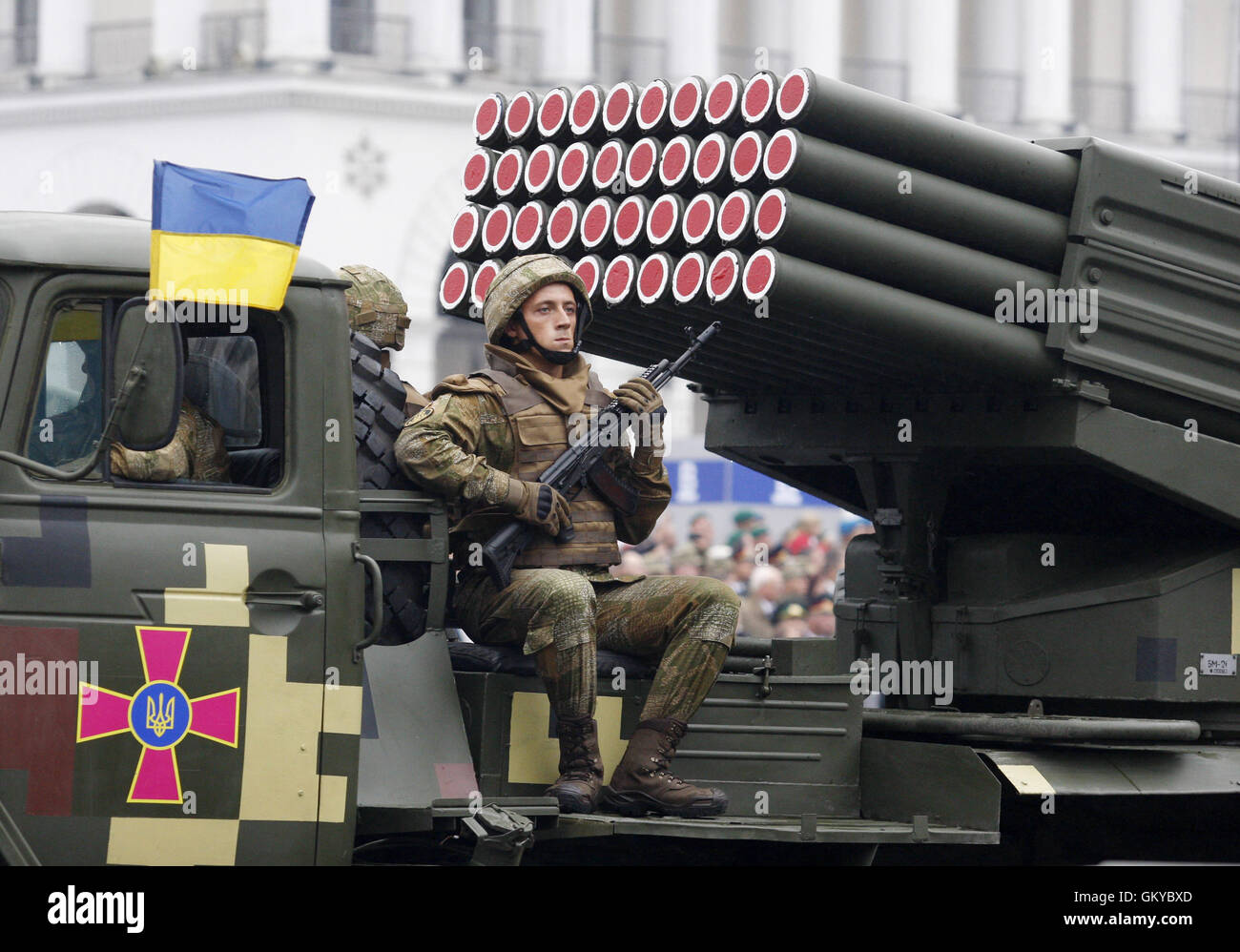 Kiev, Ukraine. 24th Aug, 2016. A Ukrainian serviceman sits on a BM-21 ...