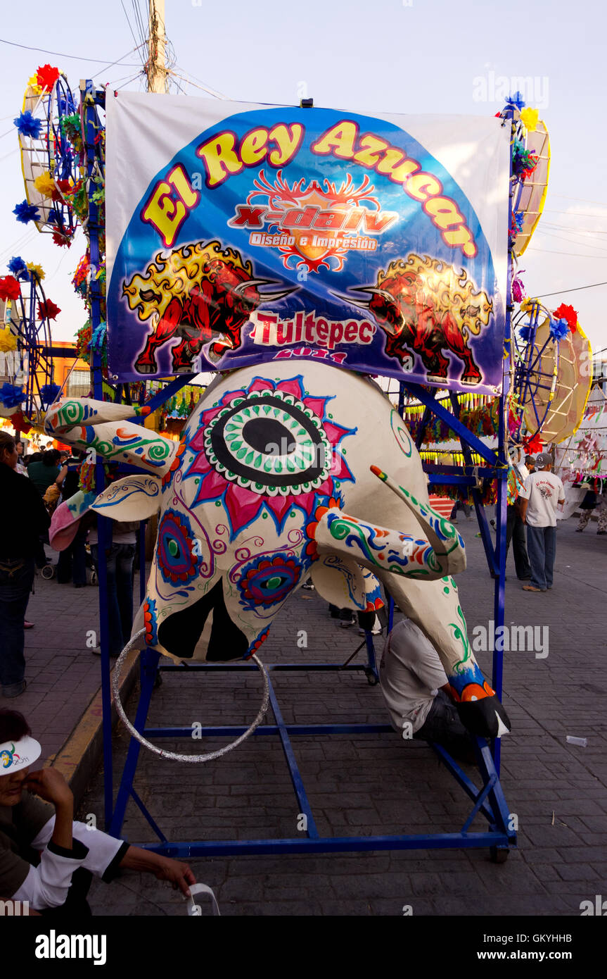 Giant cardboard bull (torito) with fireworks parading during the ...