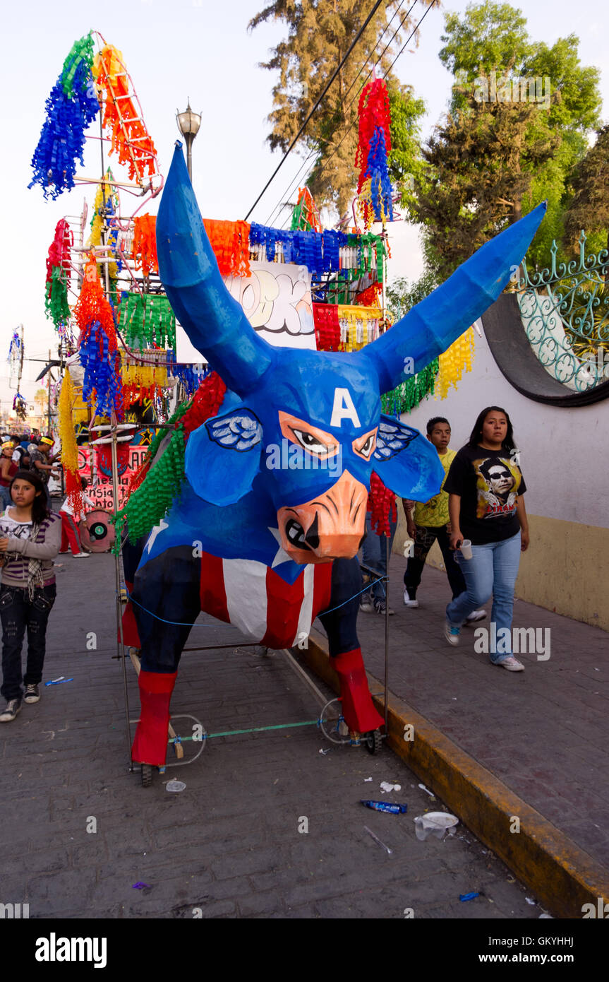 Giant cardboard bull (torito) with fireworks parading during the ...