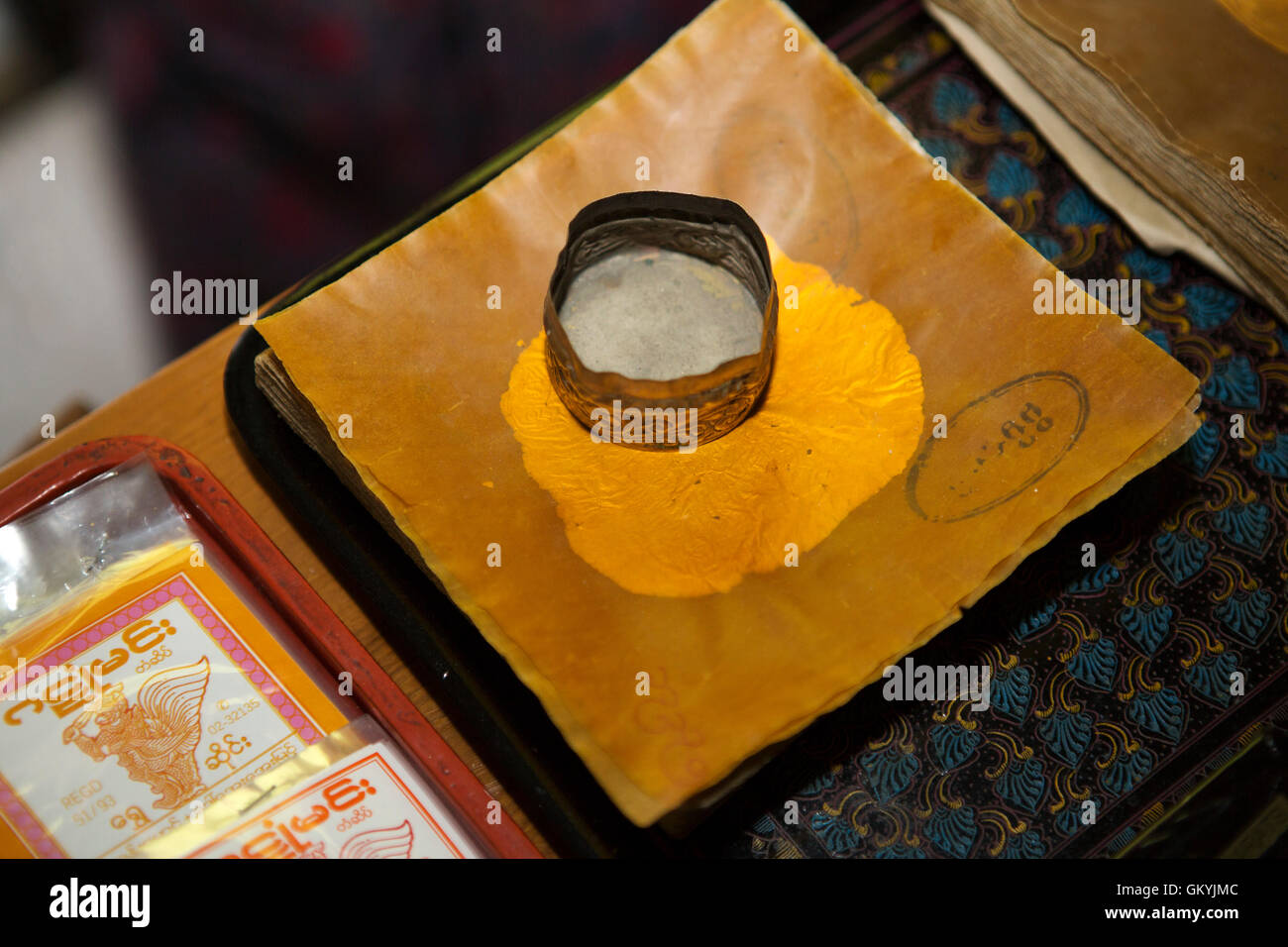 A team of Burmese men beat gold at the King Galon Workshop in Mandalay ...