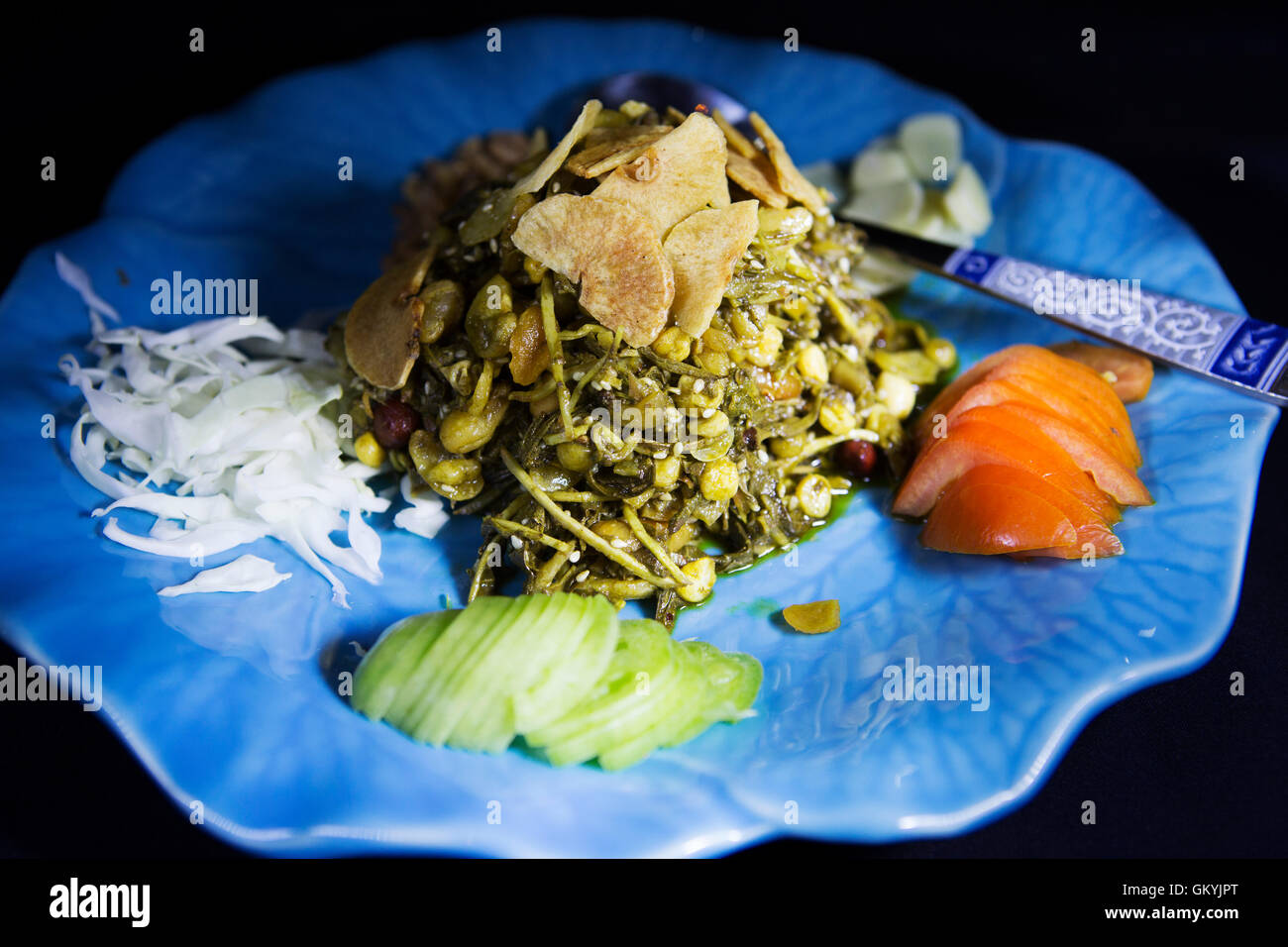 Traditional Burmese cuisine is served in Mandalay, Myanmar (Burma). A ...
