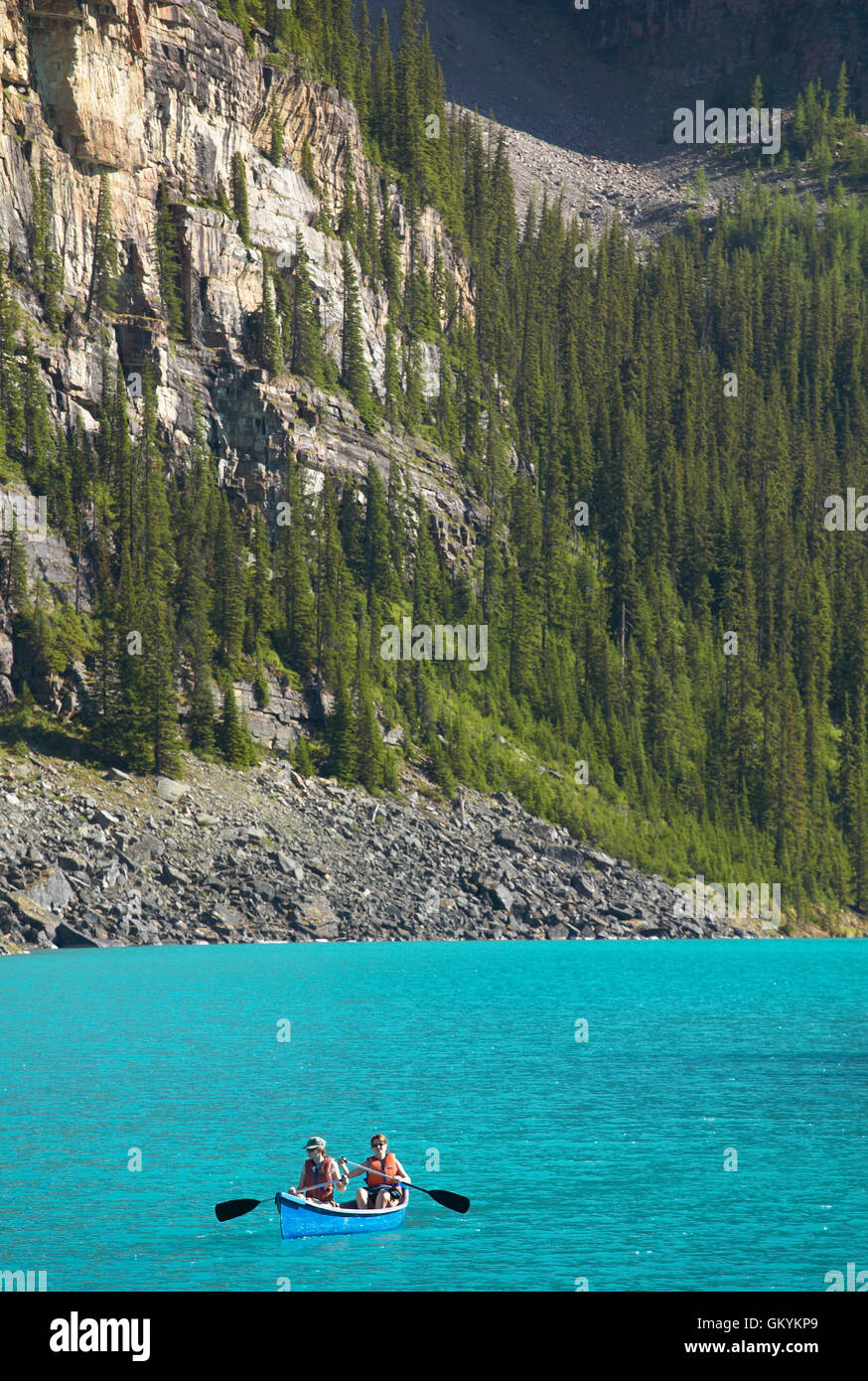 Canoeing at Moraine lake. Alberta. Canada. Vertical Stock Photo - Alamy