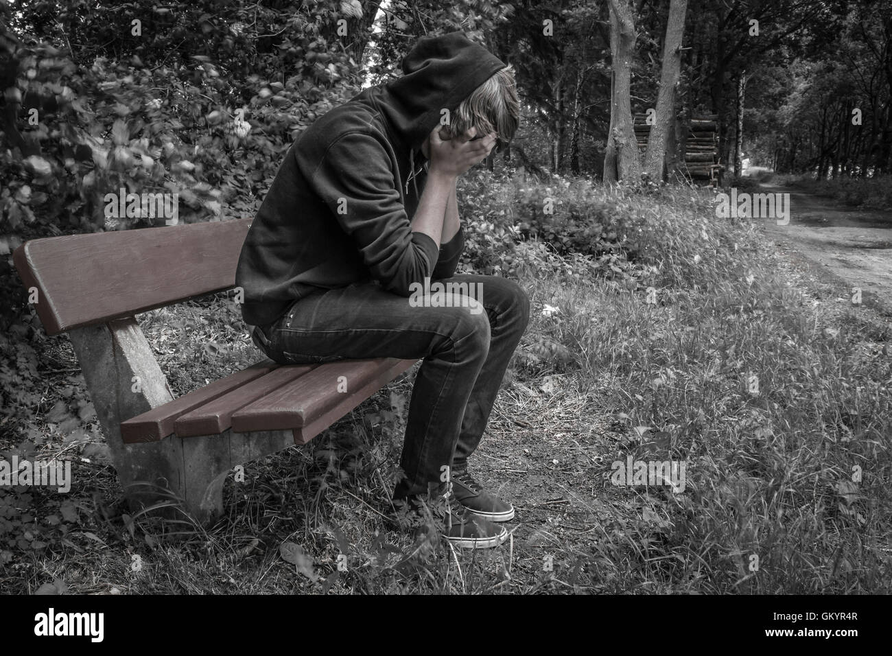 sad boy in rural landscape Stock Photo - Alamy