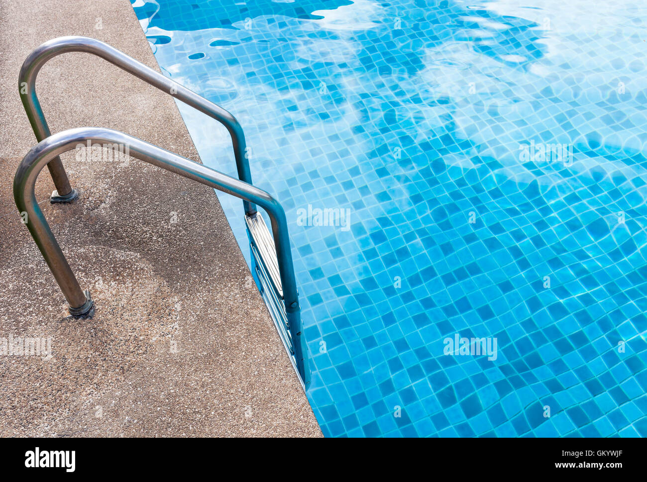 Staircase into the swimming pool with blue tiled. View from eye Stock ...