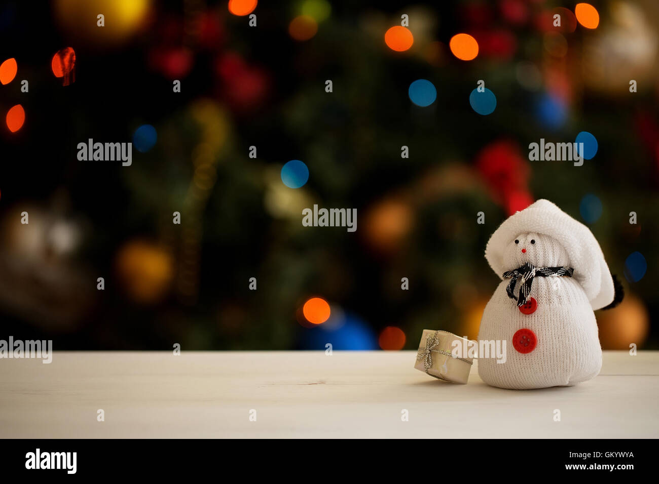 Snowman on a Christmas tree background Stock Photo - Alamy
