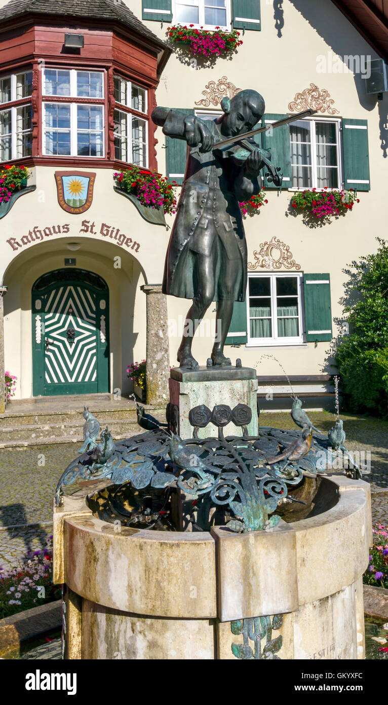 Statue of young Wolfgang Amadeus Mozart in front of townhall on ...