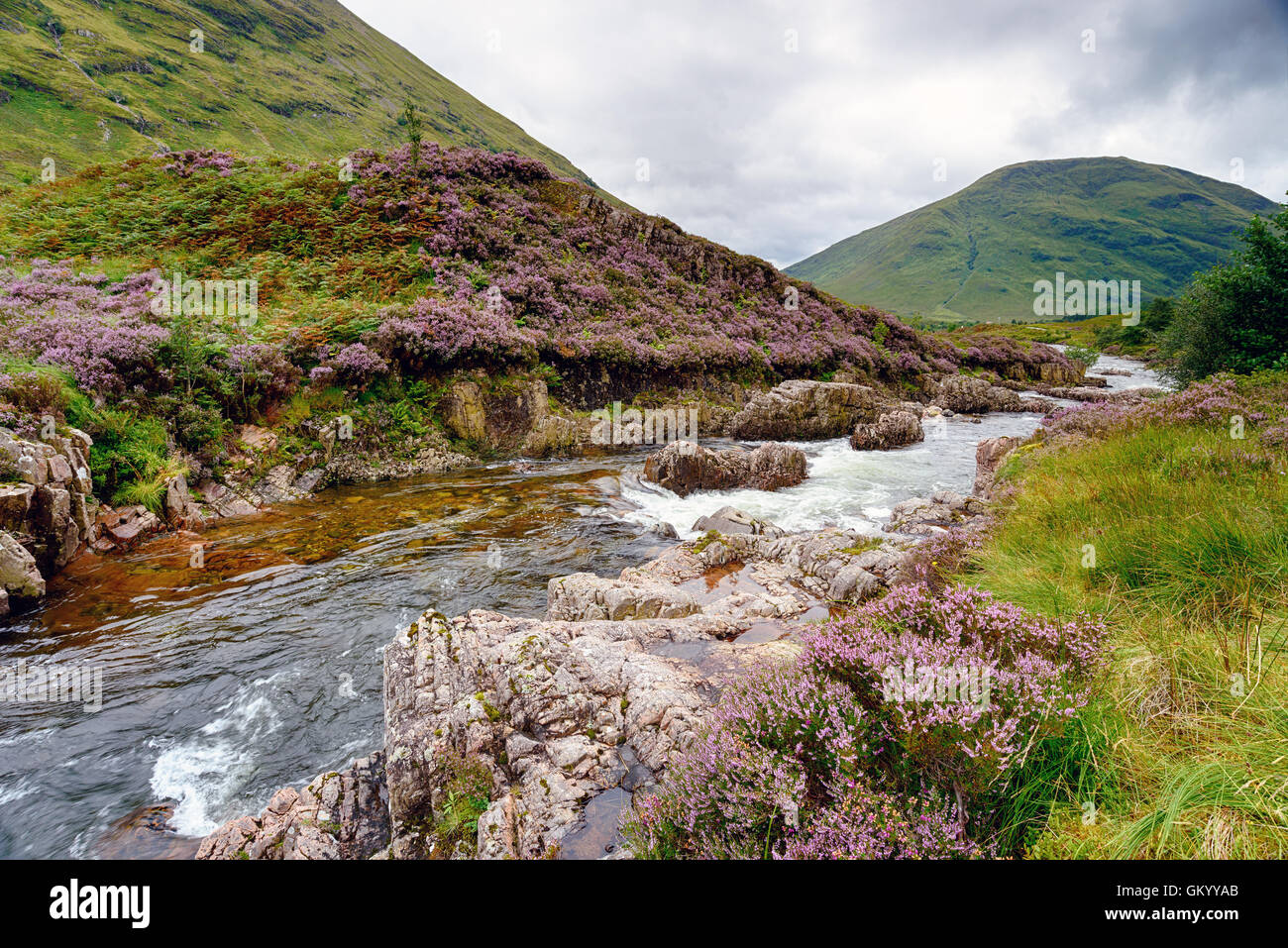 The river Coe as it flows over rocks at Glencoe in Scotland Stock Photo ...