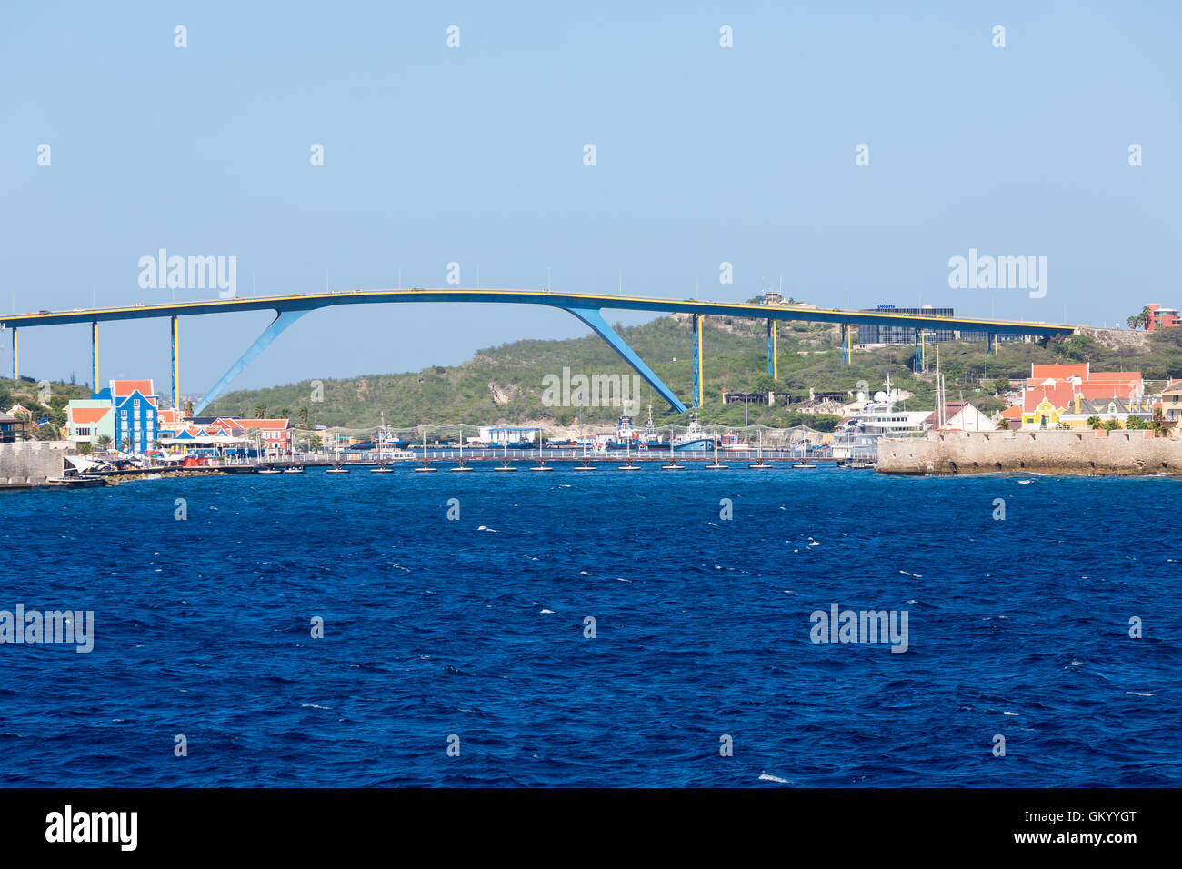 The Queen Juliana Bridge on Curacao with colorful architecture Stock ...