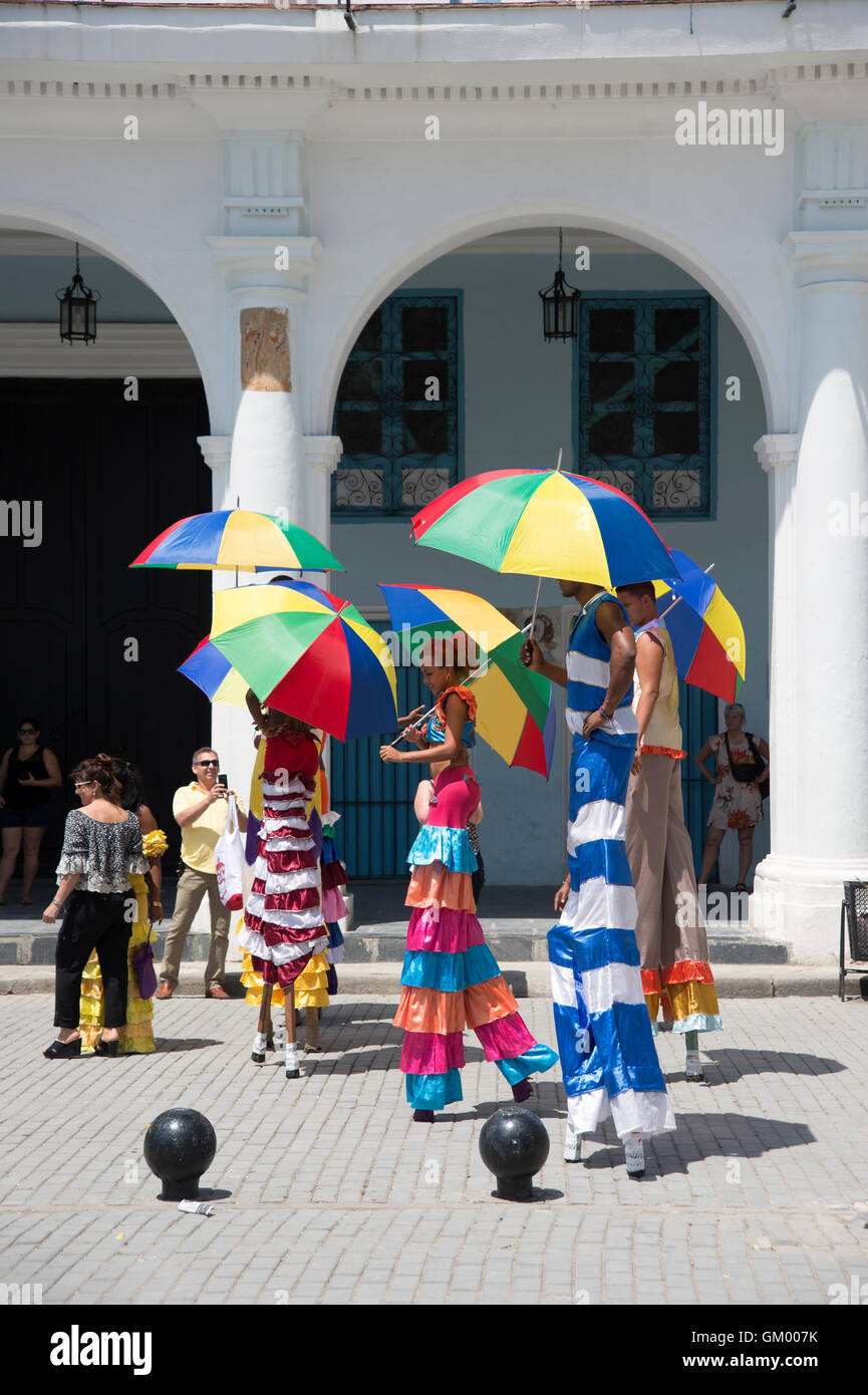 A carnival group of musicians on stilts entertain the tourists in Plaza ...