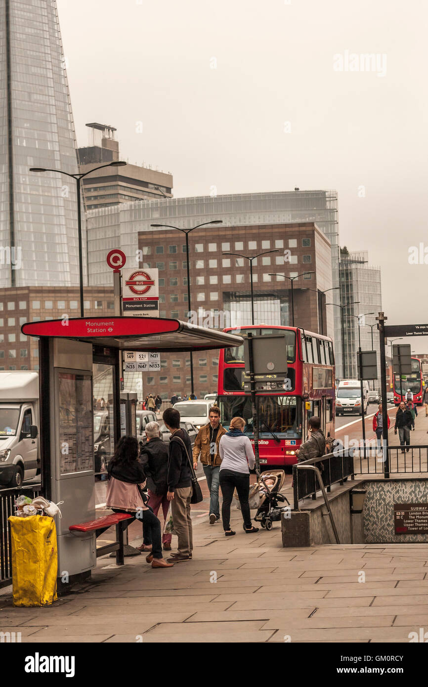 A view of the busy commuter traffic and people crossing London bridge ...