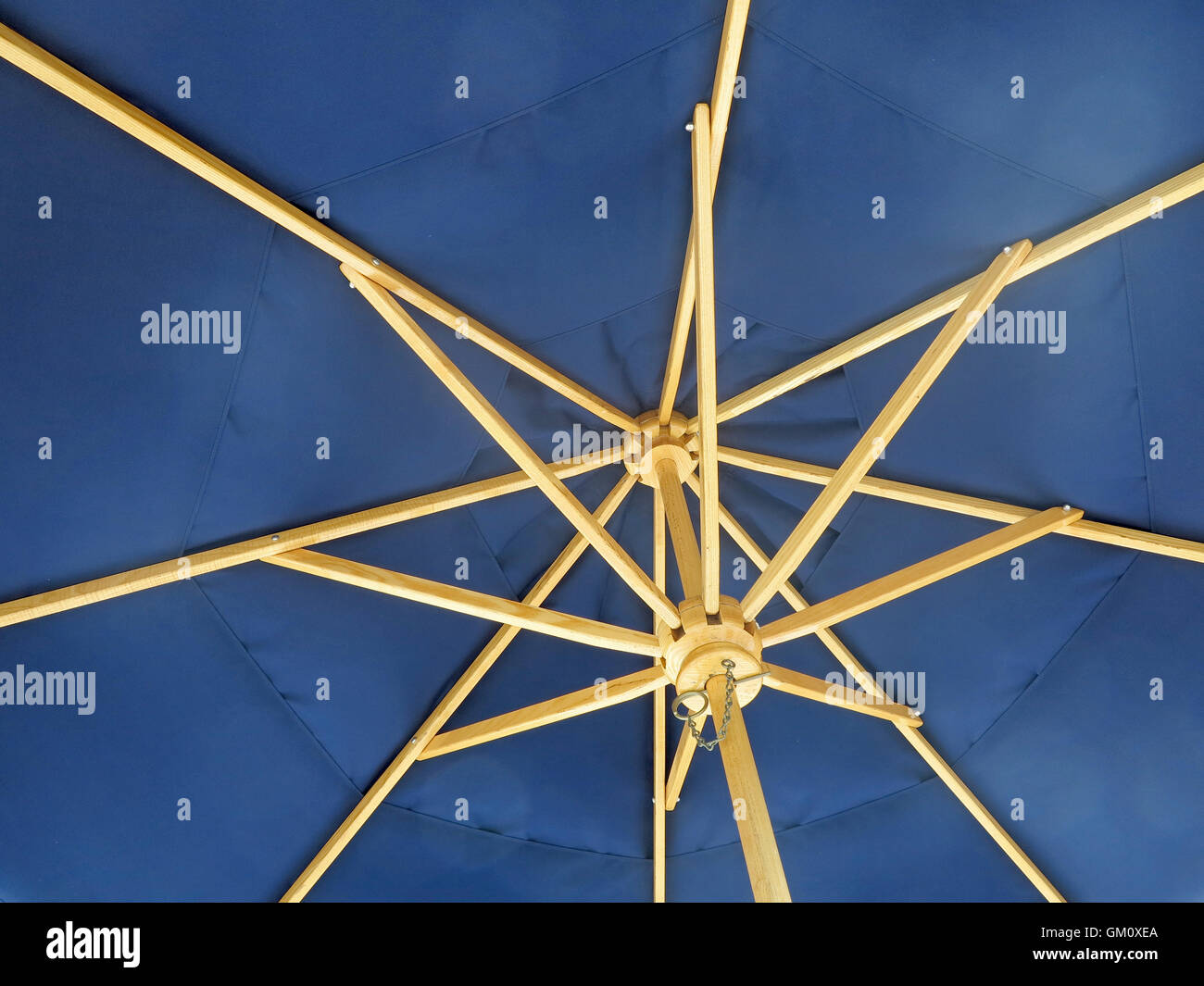 The inside of an open blue umbrella Stock Photo - Alamy
