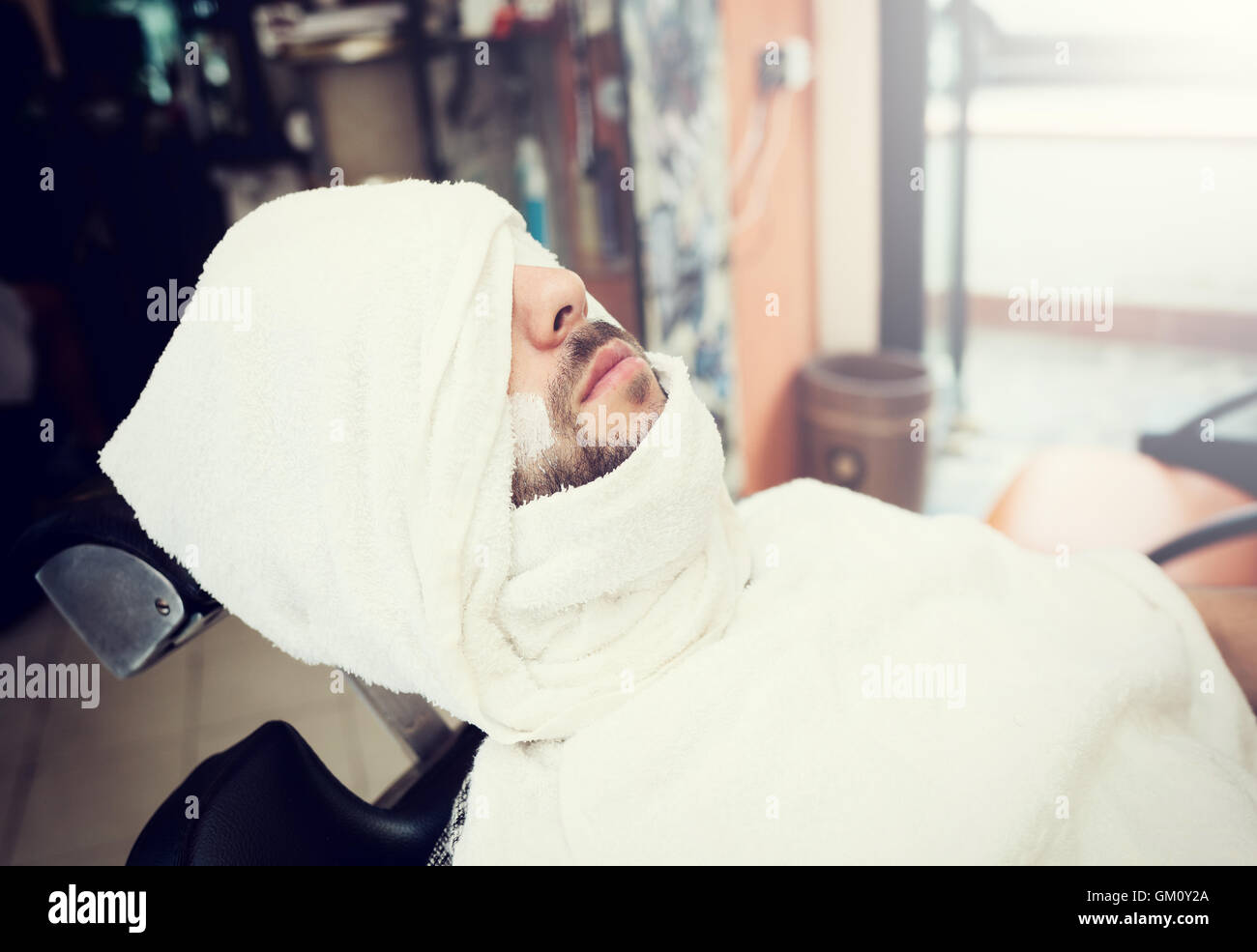 Traditional ritual of shaving the beard with hot and cold compresses in ...