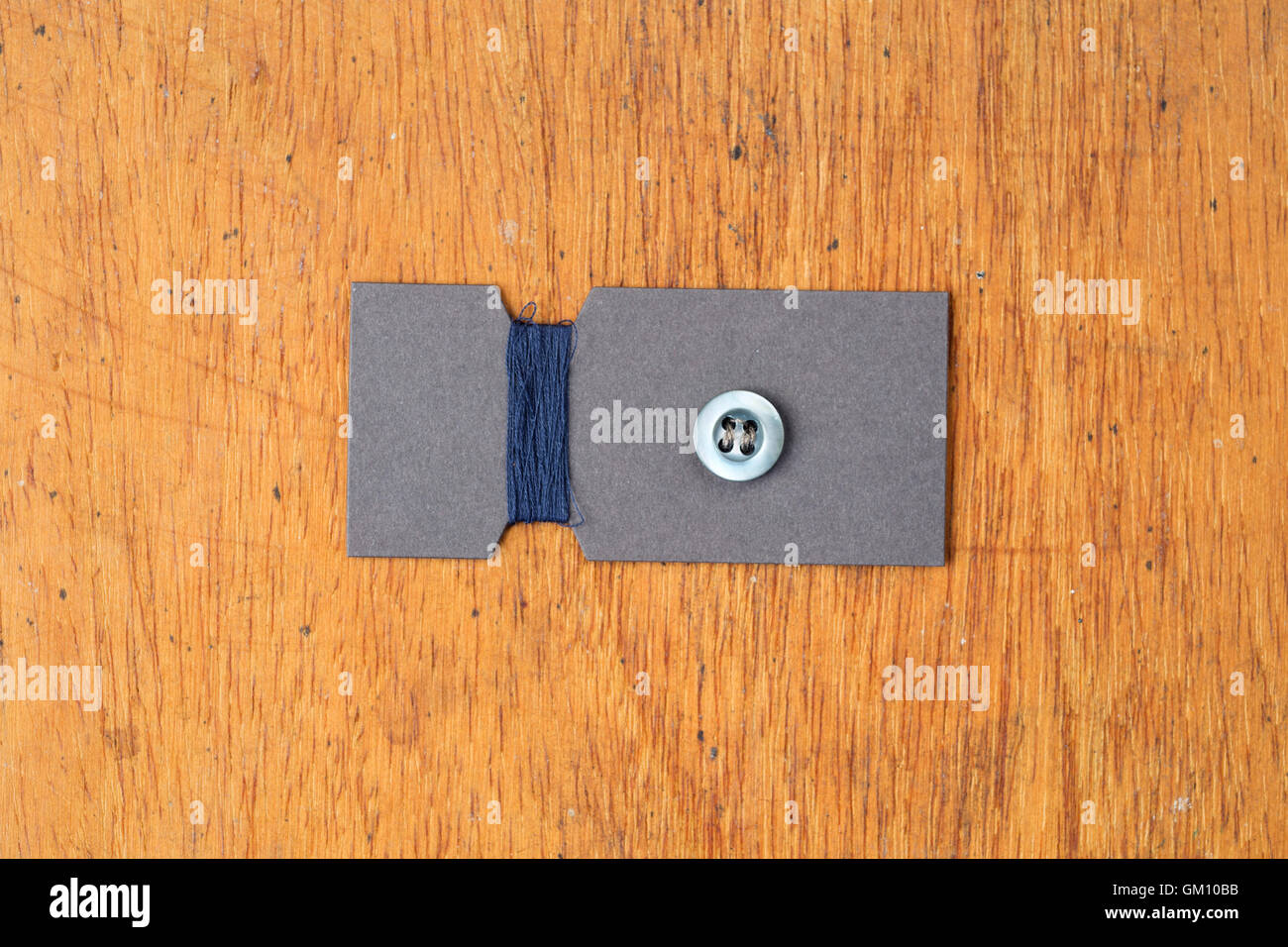 Button and thread Stock Photo - Alamy