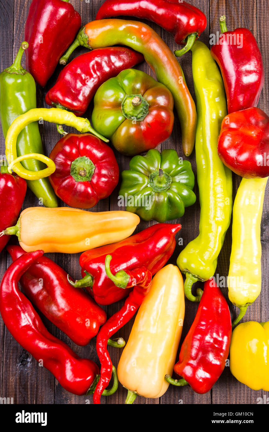 Top view of fresh colorful peppers on vintage wooden table Stock Photo ...
