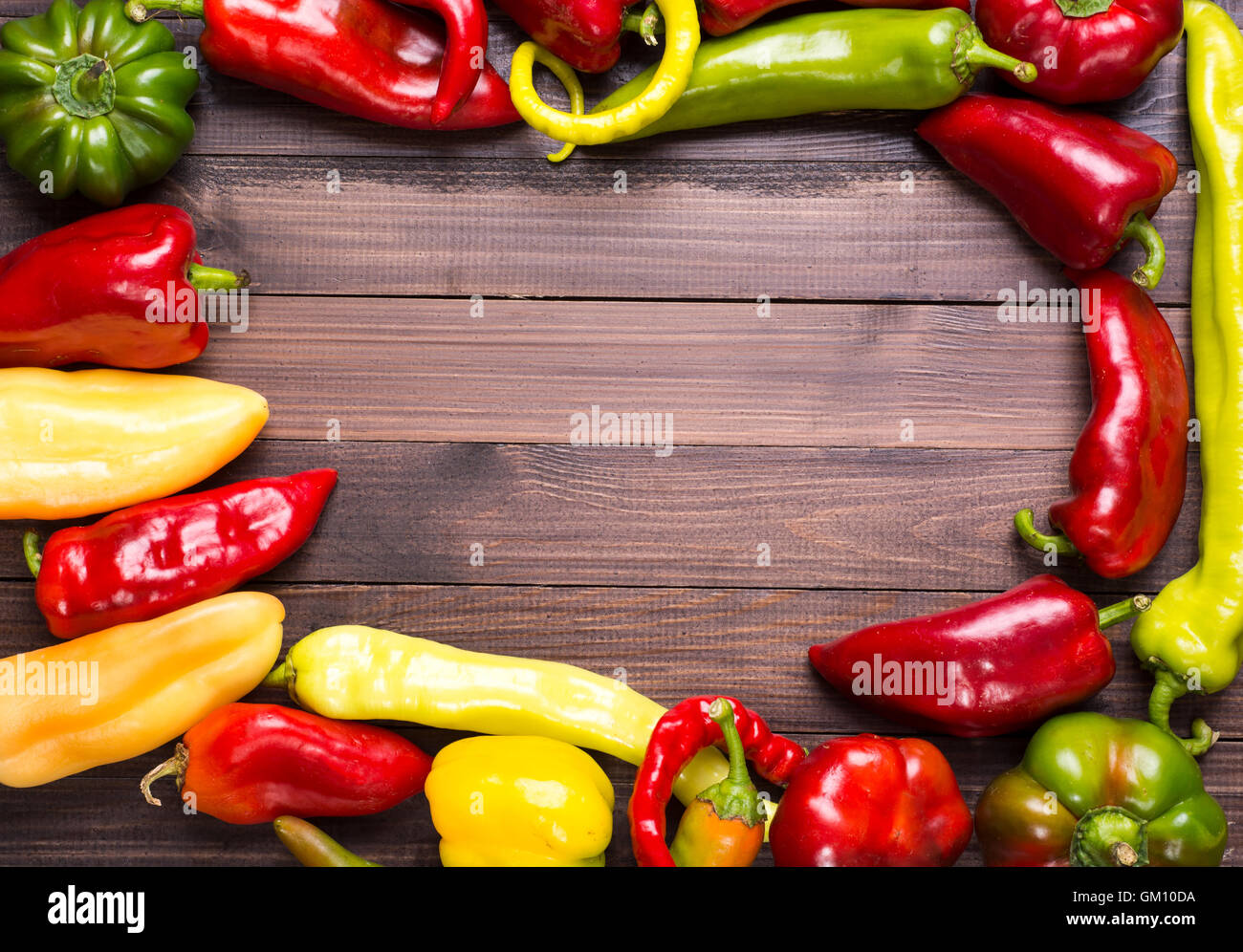 Top view of fresh colorful peppers on vintage wooden table Stock Photo ...