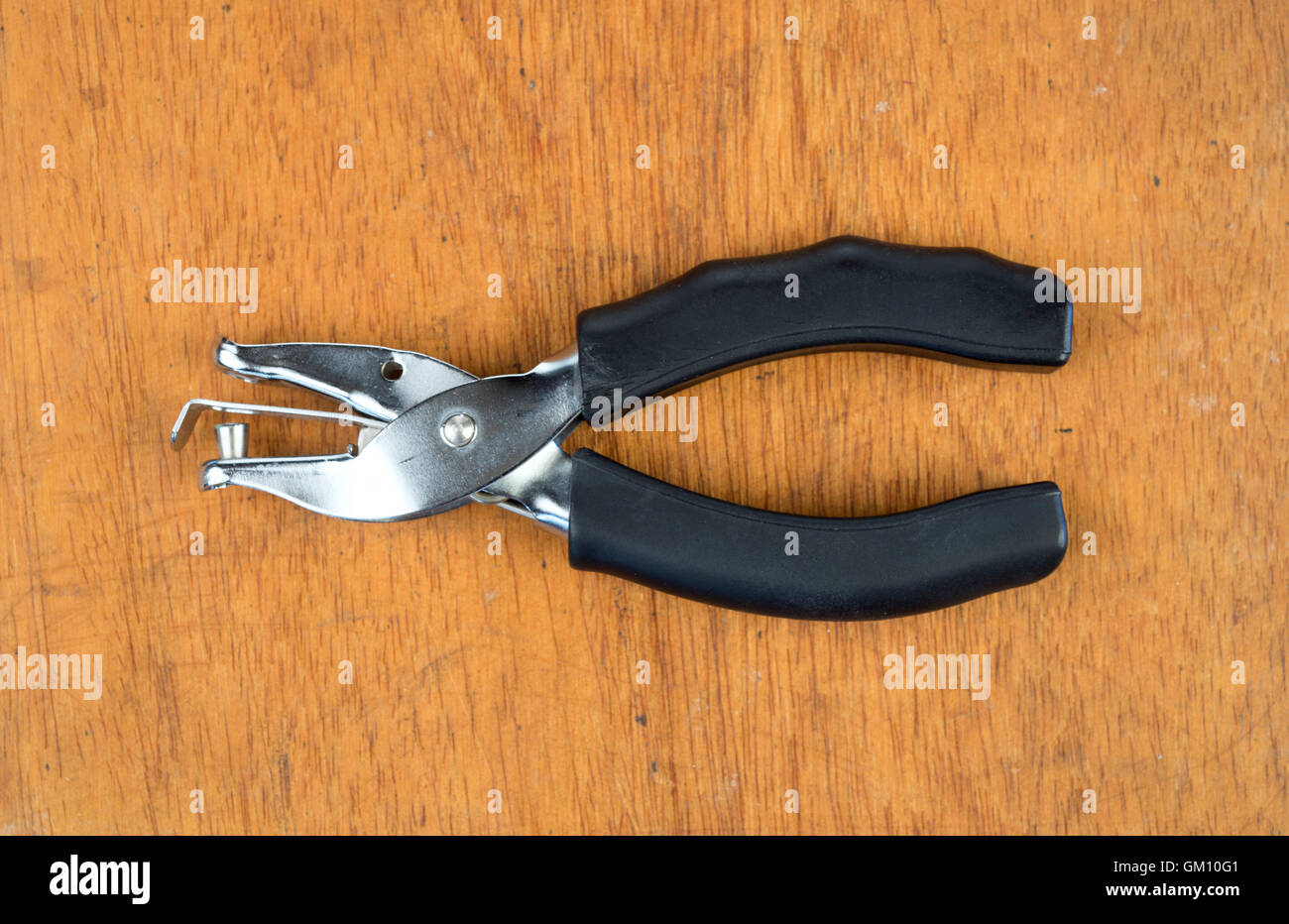 Hole puncher on a background, close up Stock Photo - Alamy