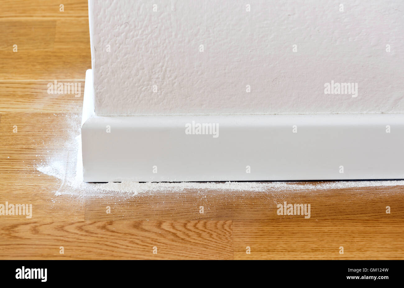 Insect powder between parquet and wooden baseboards Stock Photo - Alamy