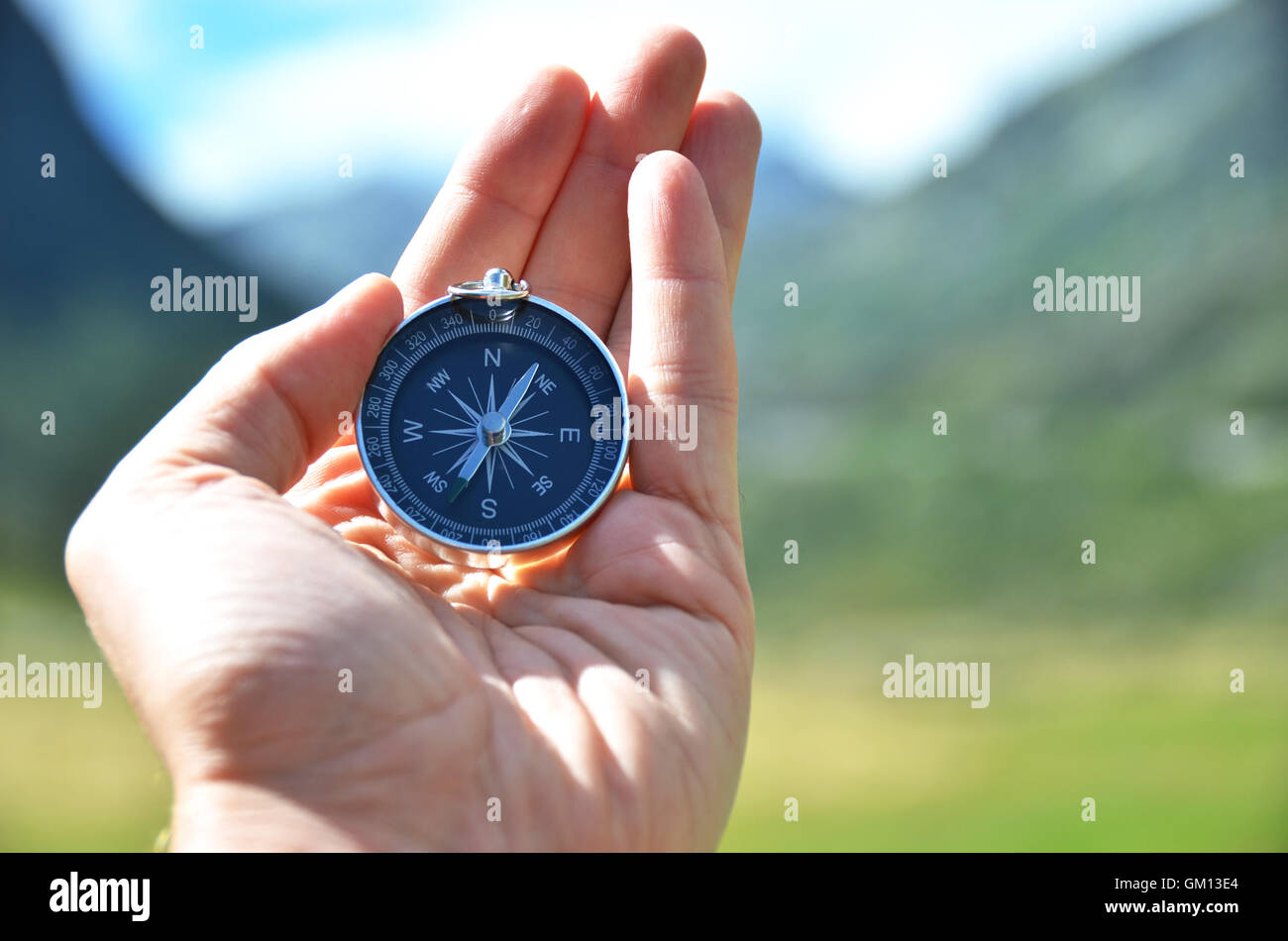 Compass in the hand Stock Photo - Alamy
