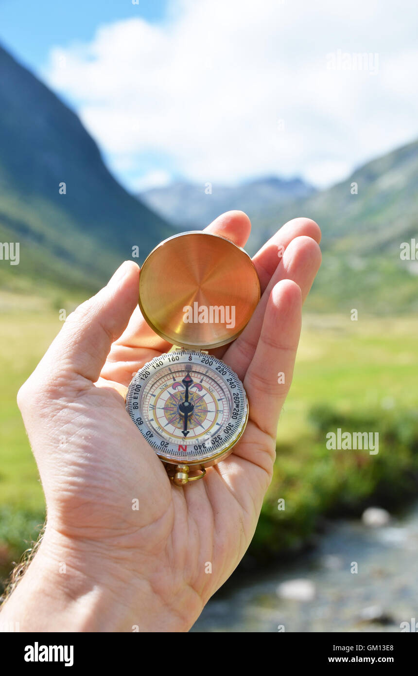 Compass in the hand Stock Photo - Alamy