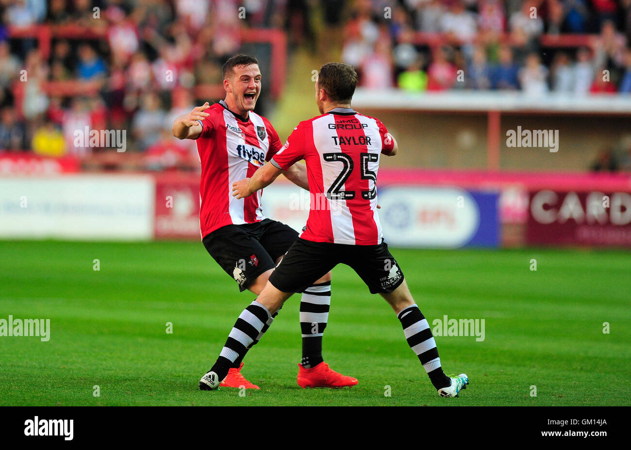 Exeter City's Jake Taylor (right) celebrates his goal to make it 1-0 ...
