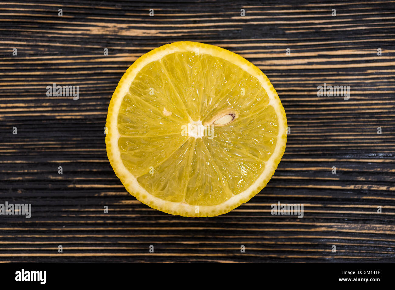 Half Cut Sliced Fresh Lemon on Wood Table Background Stock Photo - Alamy