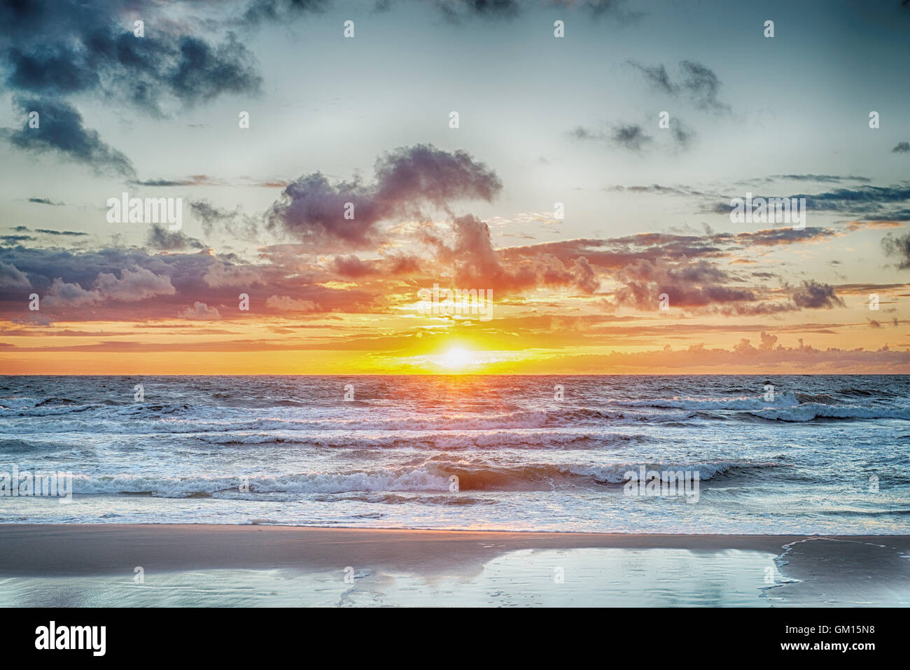 Sunset At The Stormy Sea Stock Photo - Alamy