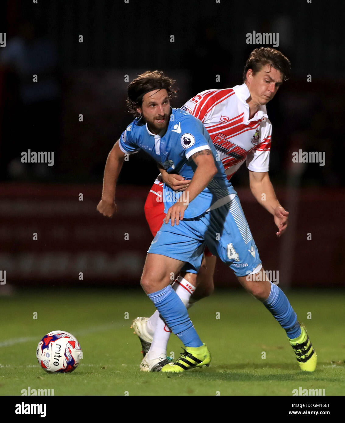Stevenage's Andrew Fox (behind) and Stoke City's Joe Allen battle for ...