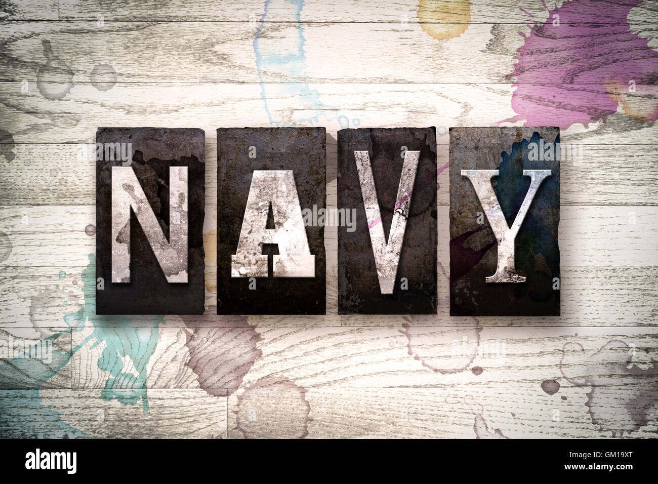 The word "NAVY" written in vintage dirty metal letterpress type on a ...