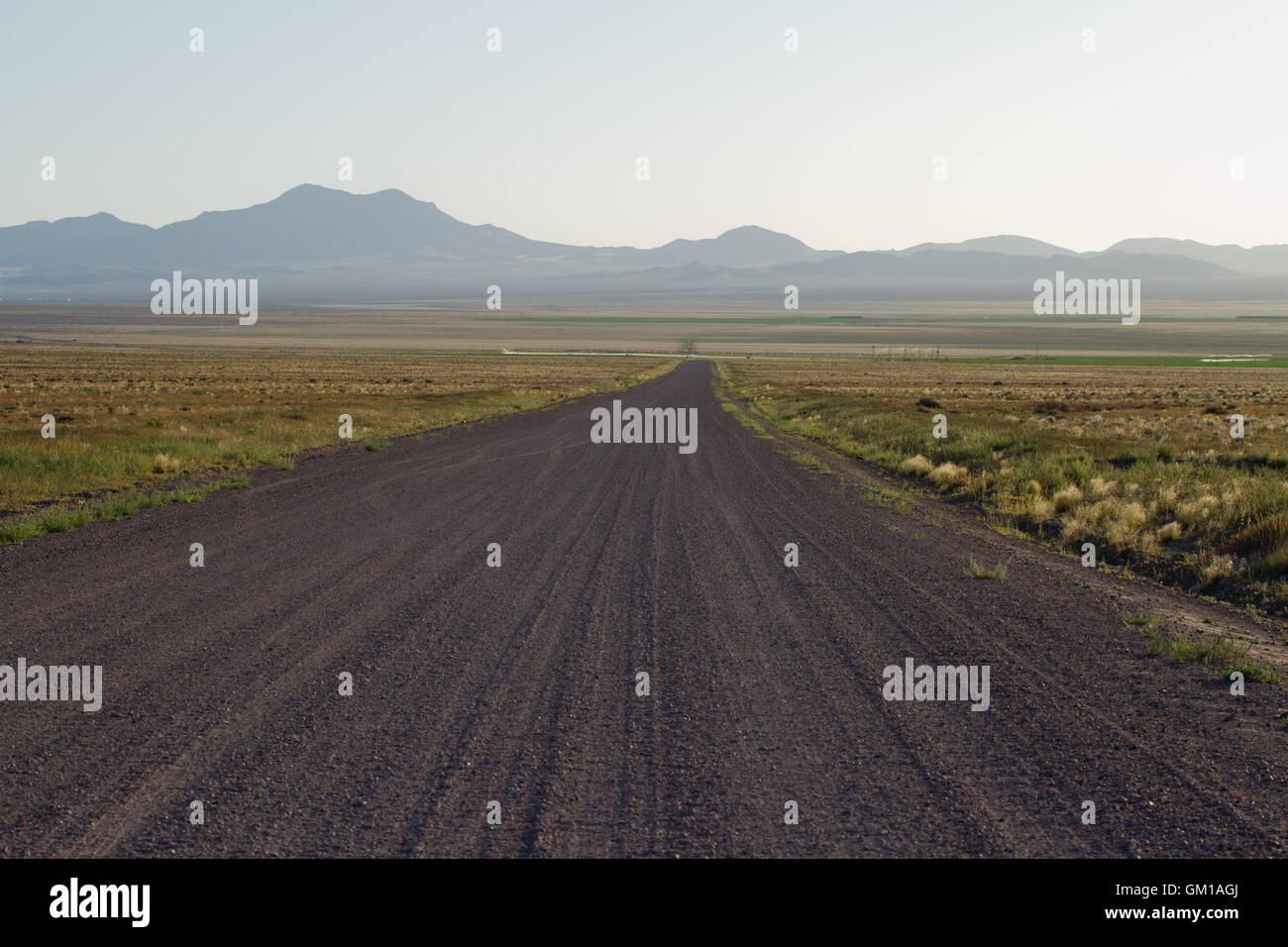 Long unpaved road though desert near Area 51. Nevada. USA Stock Photo ...