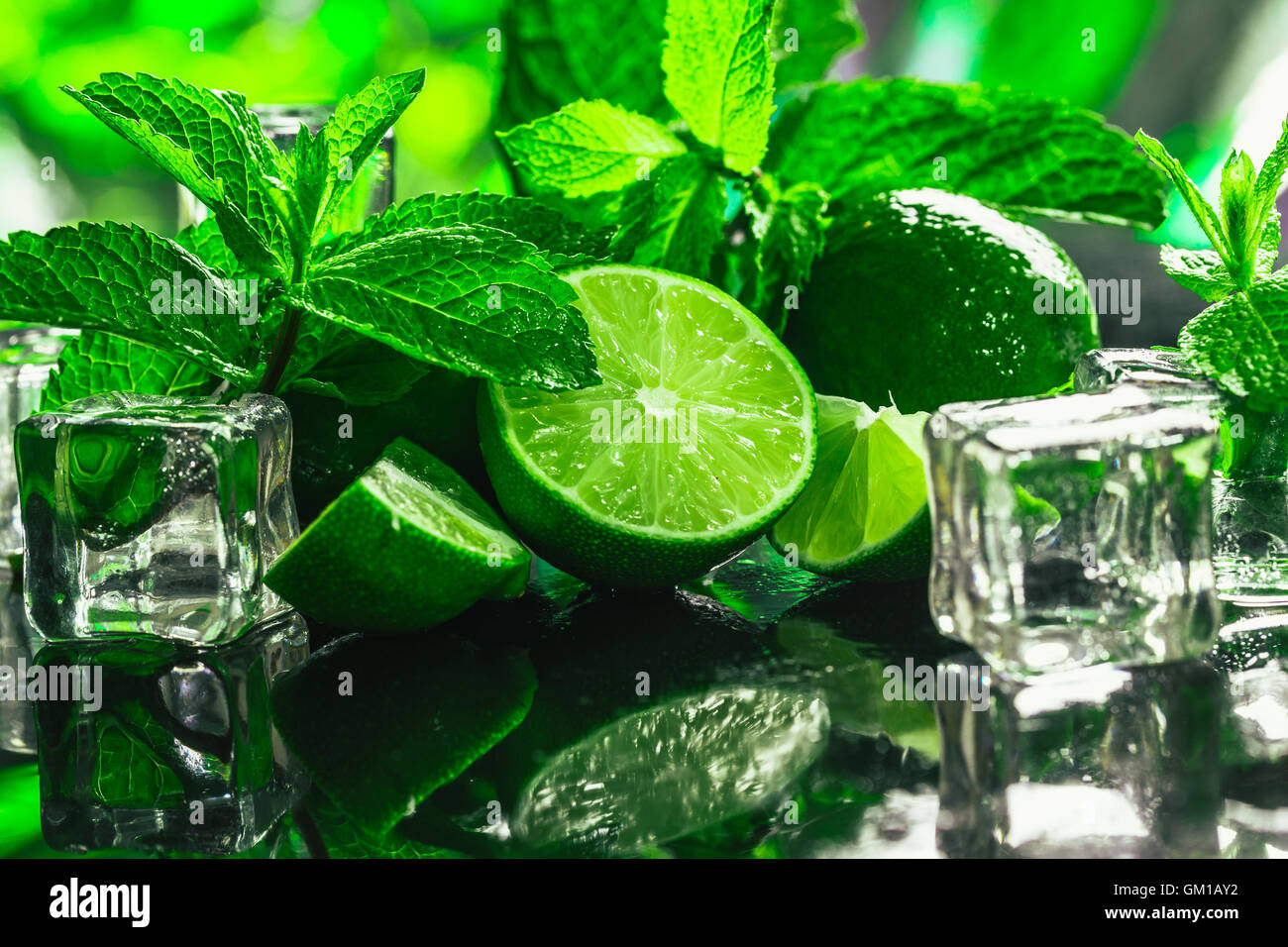 fresh green mint and lime ice cube close-up on a dark background Stock Photo - Alamy