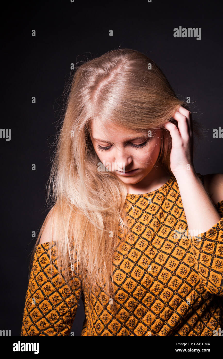 Portraits in studio of a blond girl Stock Photo - Alamy