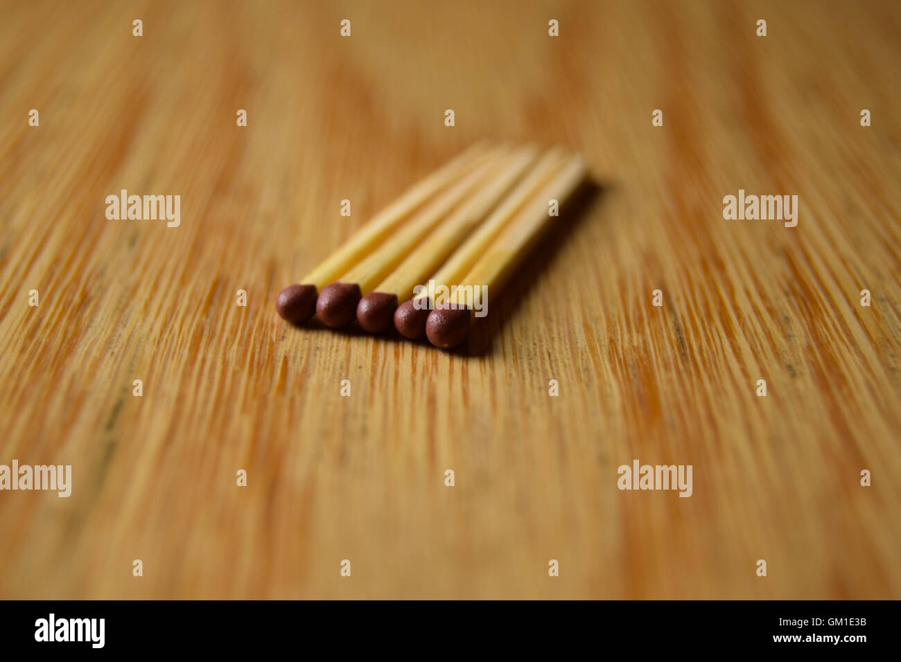five matches lying on table in a line, close up Stock Photo - Alamy