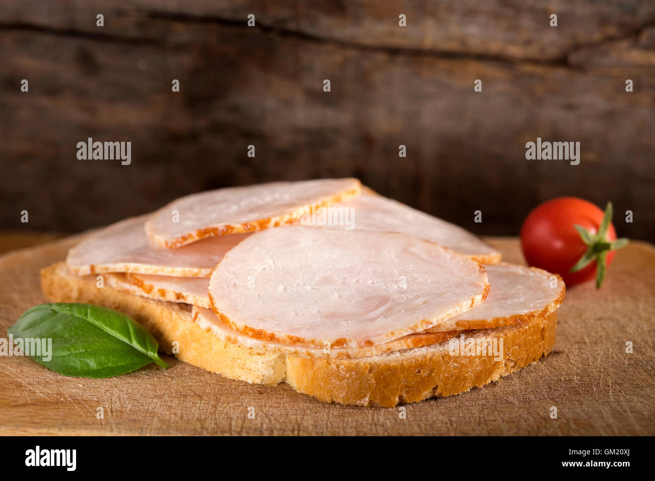 Open faced chicken ham sandwich over wooden background Stock Photo - Alamy