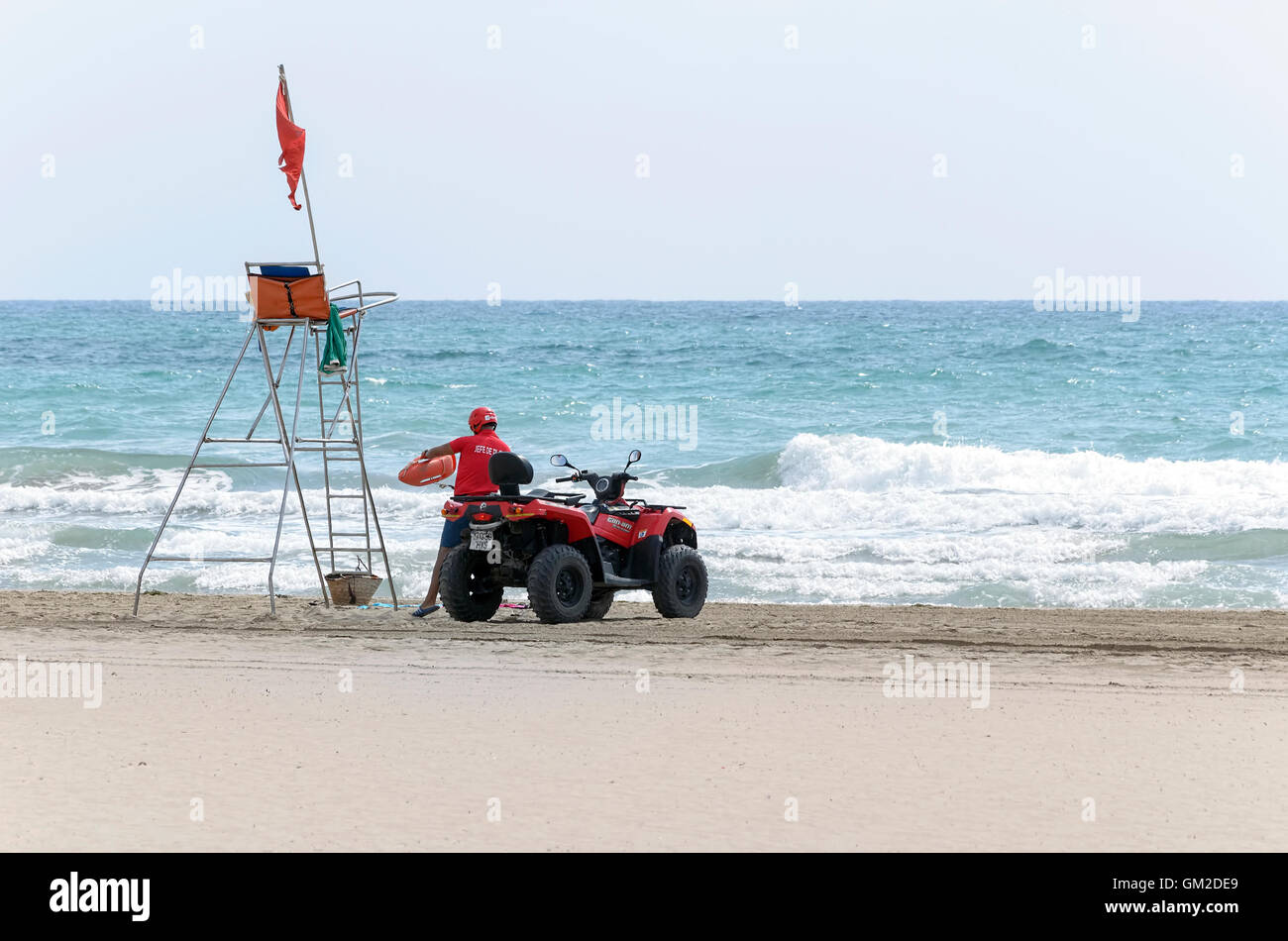 Observation post. Lifeguard boss with -Can-Am Outlander 400- four ...